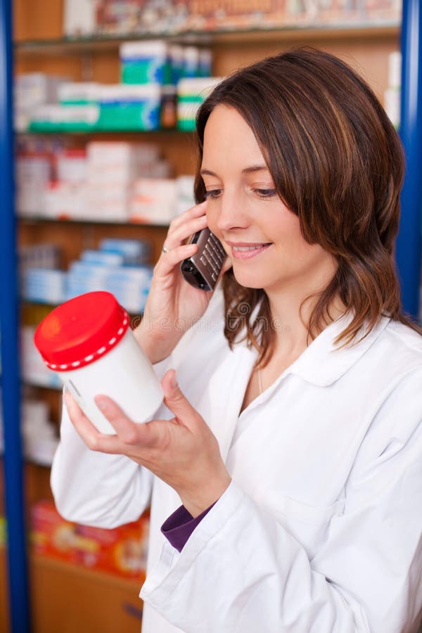 Pharmacist Talking on Phone Stock Photo - Image of chemist, phone: 31234260