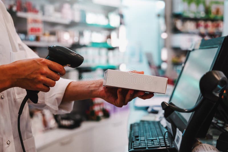 Pharmacist Uses Barcode Reader To Identify and Sell a Drug Stock Image ...