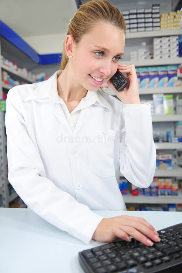 Pharmacist using computer stock image. Image of blond - 10630827