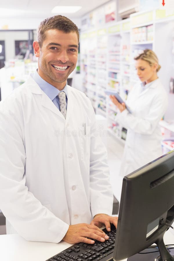Pharmacist Using the Computer Stock Image - Image of people, happy ...