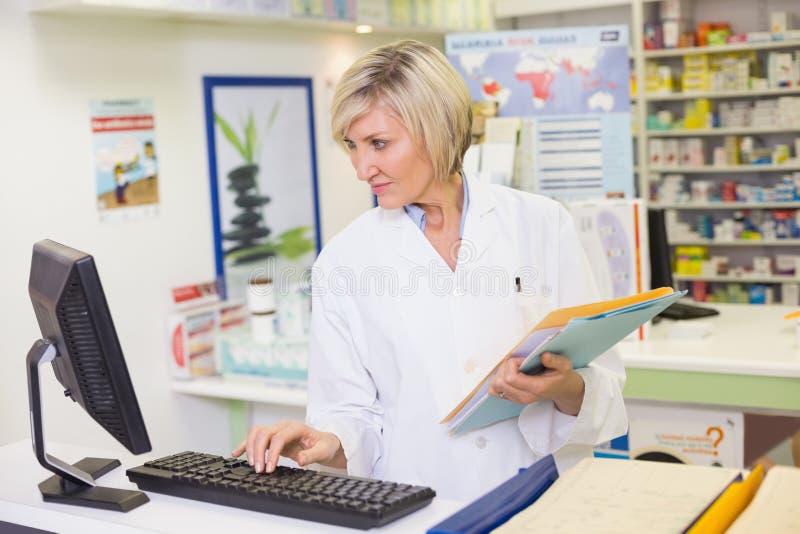 Pharmacist Using the Computer Stock Photo - Image of female, care: 51797992