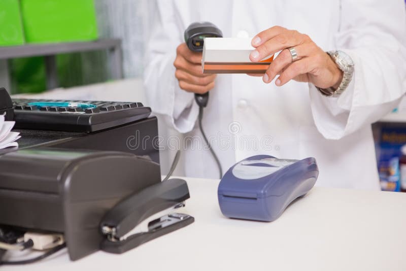 Pharmacist Using Machine and Holding Medicine Stock Image - Image of ...