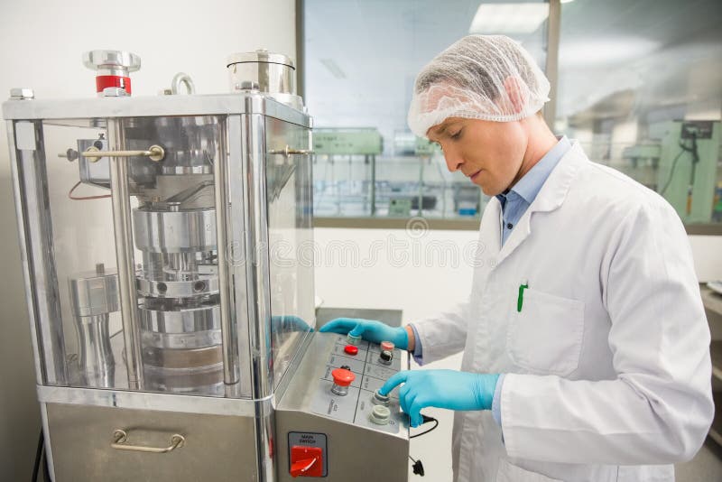 Pharmacist Using Machinery To Make Medicine Stock Photo - Image of ...