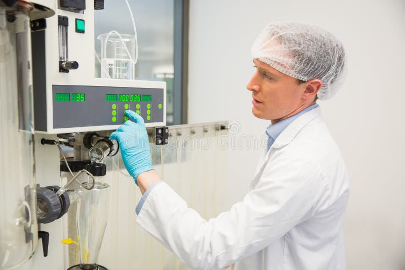 Pharmacist Using Machinery To Make Medicine Stock Image - Image of ...