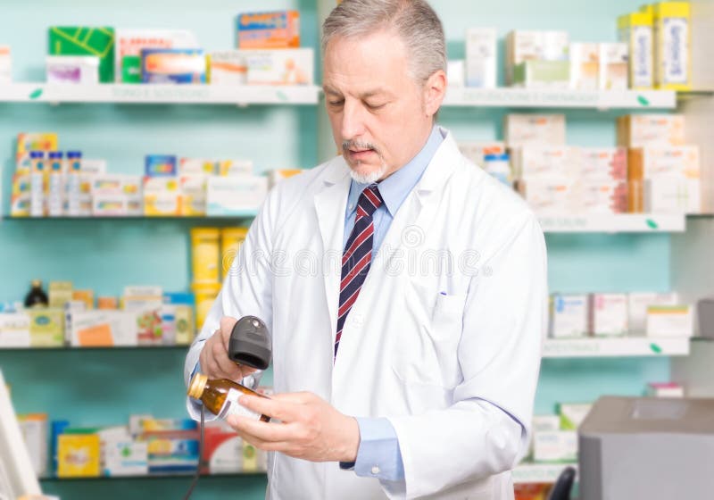 Pharmacist at work stock photo. Image of barcode, medicine - 26708764