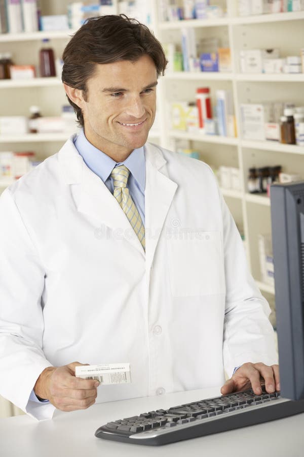Pharmacist Working on Computer in Pharmacy Stock Image - Image of ...