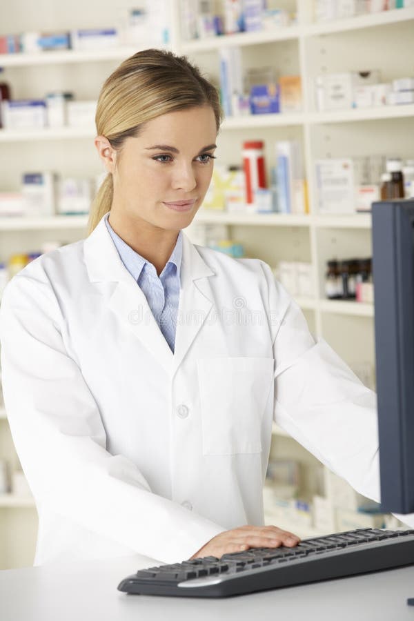 Pharmacist Working on Computer in Pharmacy Stock Image - Image of ...