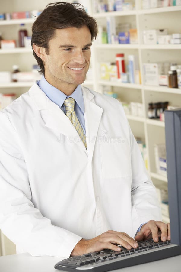 Pharmacist Working on Computer in Pharmacy Stock Photo - Image of ...
