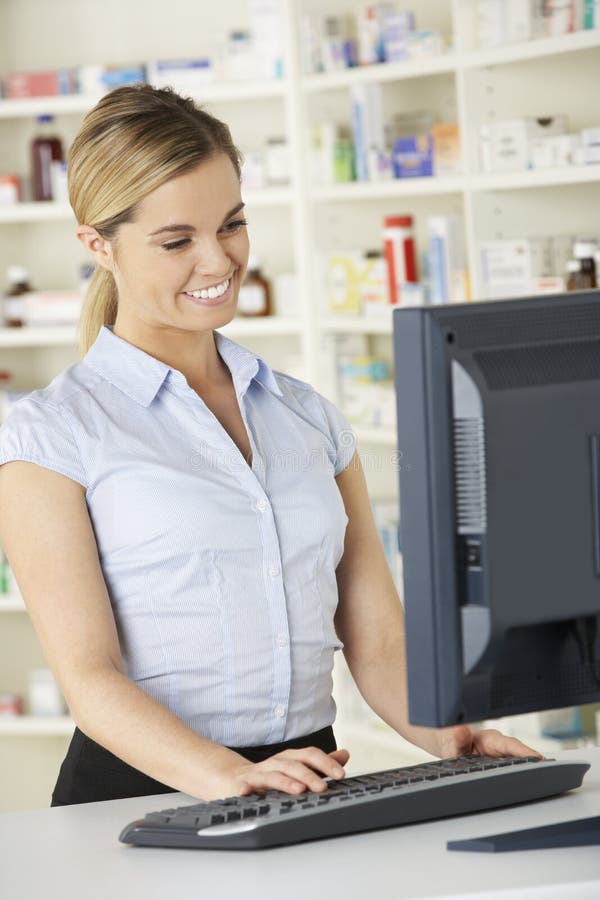 Pharmacist Working on Computer in Pharmacy Stock Image - Image of ...