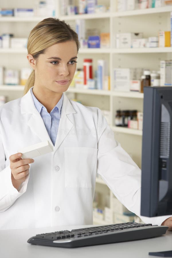 Pharmacist Working on Computer in Pharmacy Stock Image - Image of ...