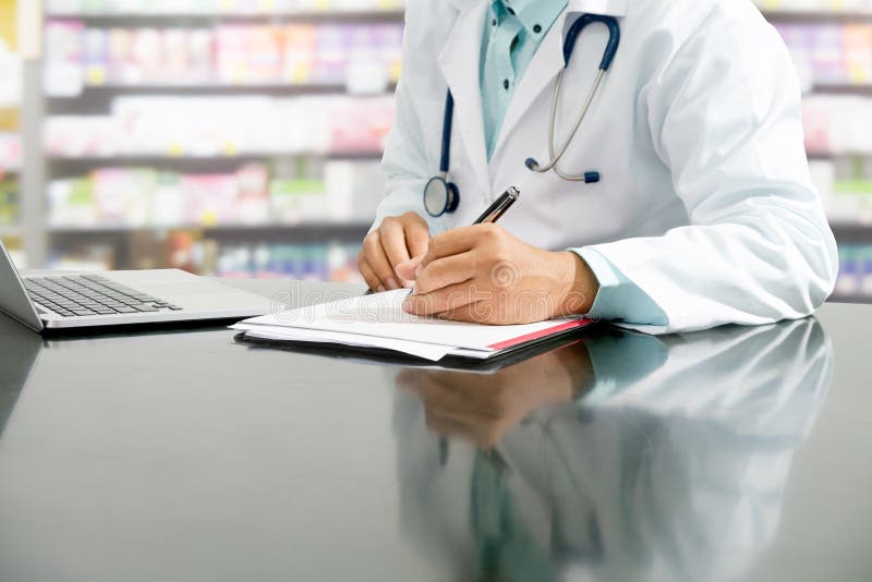 Pharmacist Writes on Documents at Pharmacy Stock Photo - Image of ...