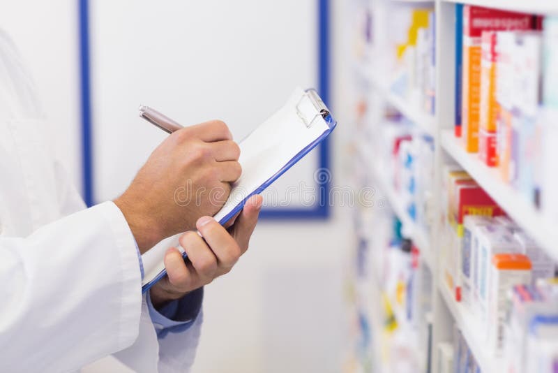 Pharmacist Writing on Clipboard Stock Photo - Image of medicament, care ...
