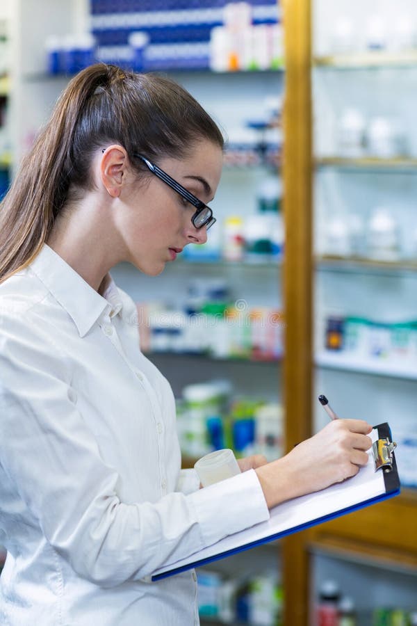 Pharmacist Writing on Clipboard Stock Photo - Image of medical ...