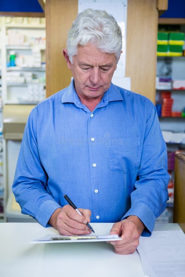 Pharmacist Writing on Clipboard Stock Image - Image of pharmaceutics ...