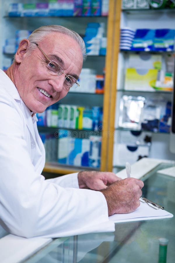 Pharmacist Writing on Clipboard Stock Photo - Image of notepad ...