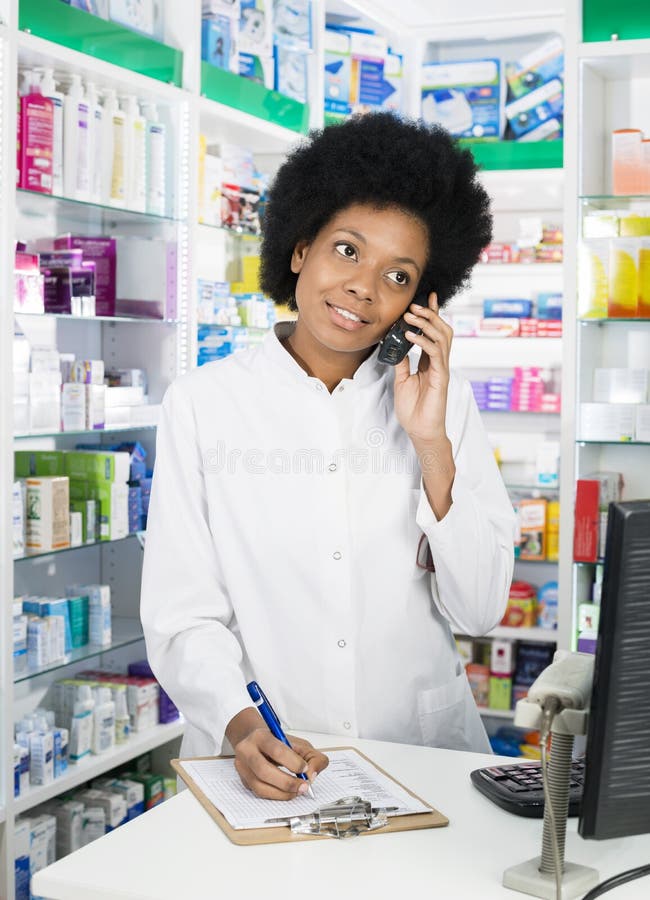 Confident Pharmacist Calling Stock Photo - Image of cordless ...
