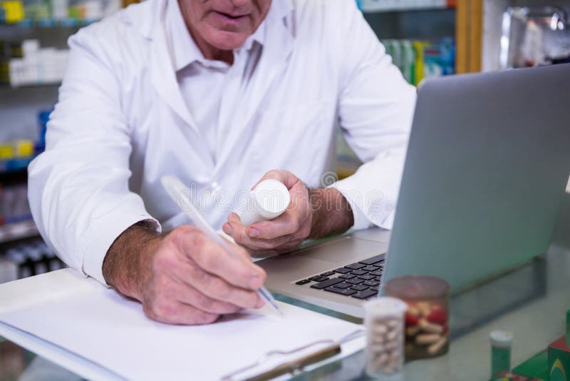 Pharmacist Writing Prescriptions for Medicines Stock Photo - Image of ...
