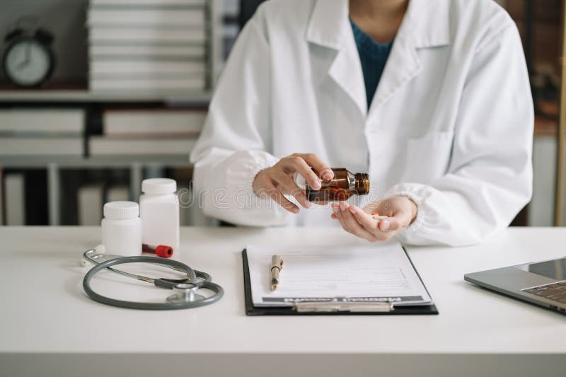 Pharmacists or Doctors Study Information about Tablets in the Room ...