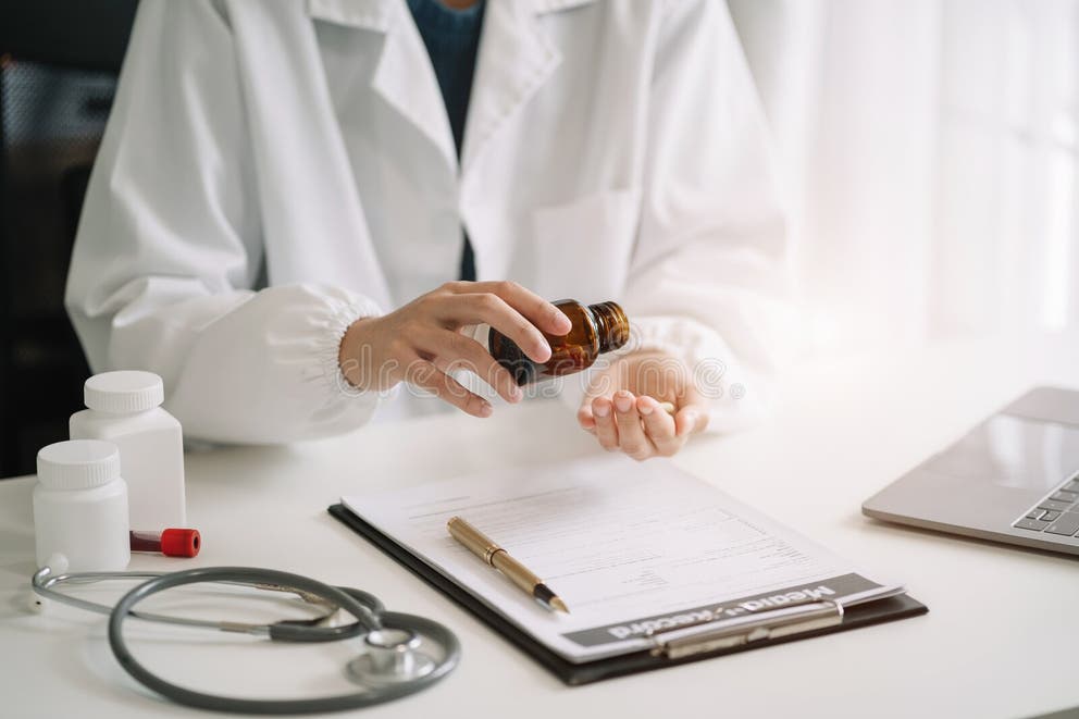 Pharmacists or Doctors Study Information about Tablets in the Room ...