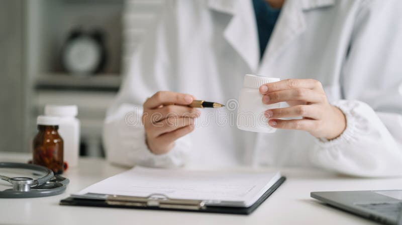 Pharmacists or Doctors Study Information about Tablets in the Room ...