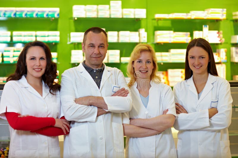 Happy pharmacy team stock photo. Image of disease, counter - 21668438