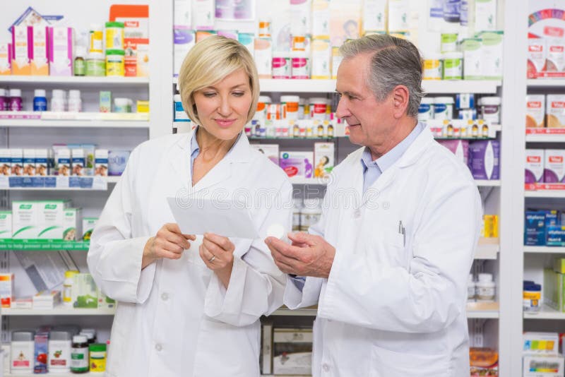 Pharmacists Team Interacting about Prescription Stock Image - Image of ...
