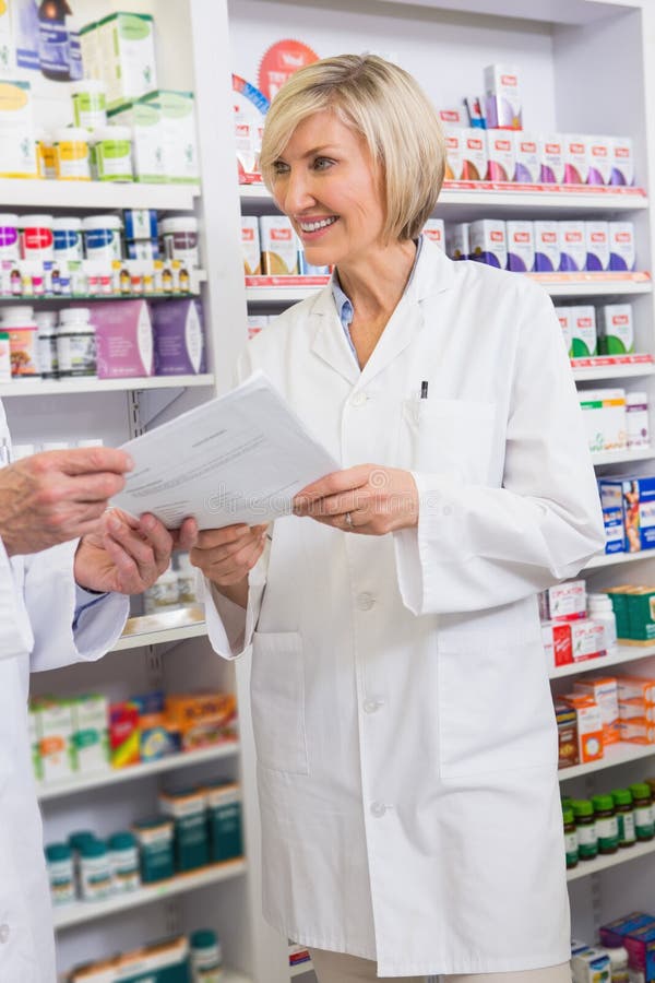 Pharmacists Team Interacting about Prescription Stock Image - Image of ...