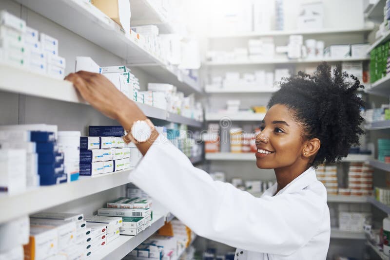 Pharmacy, Boxes and African Woman at Shelf To Check Medical Info ... Pharmacy, Boxes and African Woman at Shelf To Check Medical Info ...