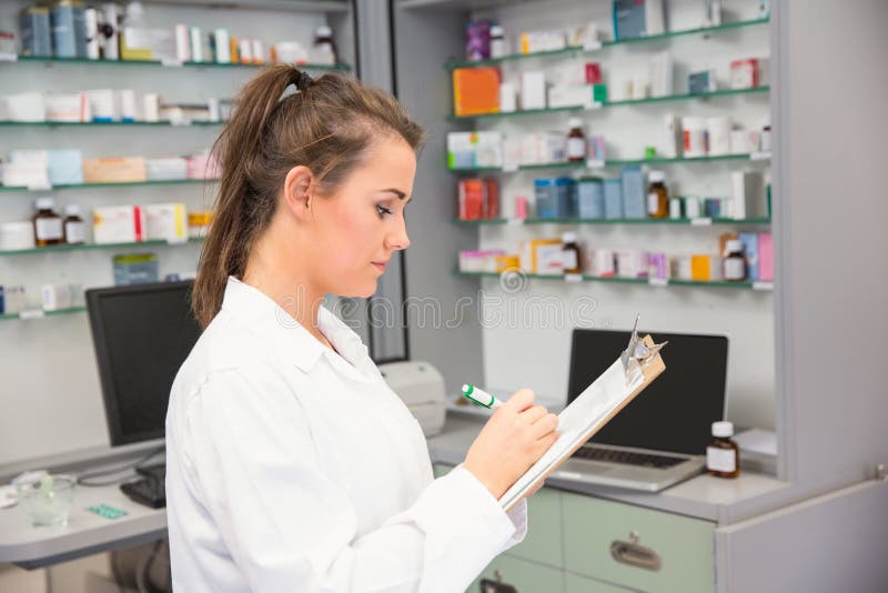 Pharmacy Intern Writing on Clipboard Stock Image - Image of pharmacist ...