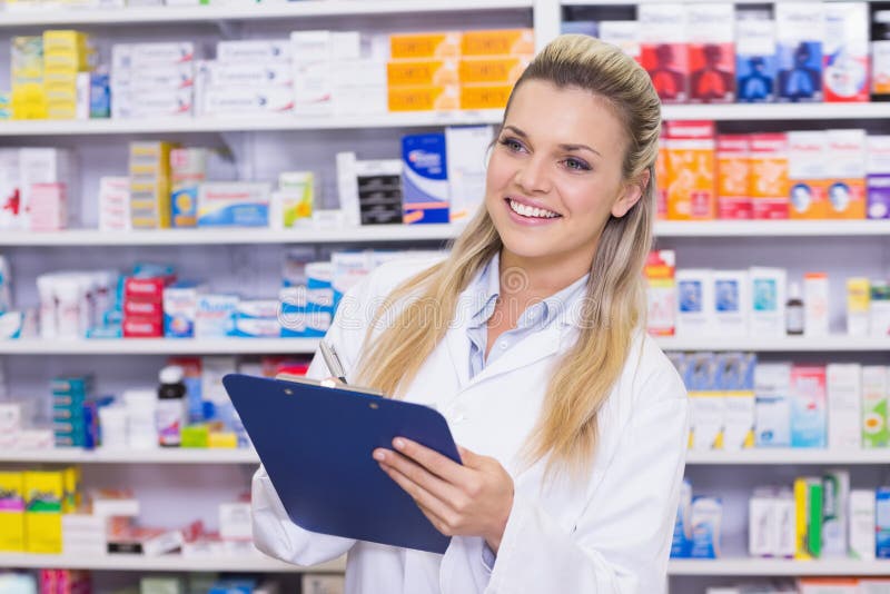 Pharmacy Intern Writing on Clipboard Stock Photo - Image of ...