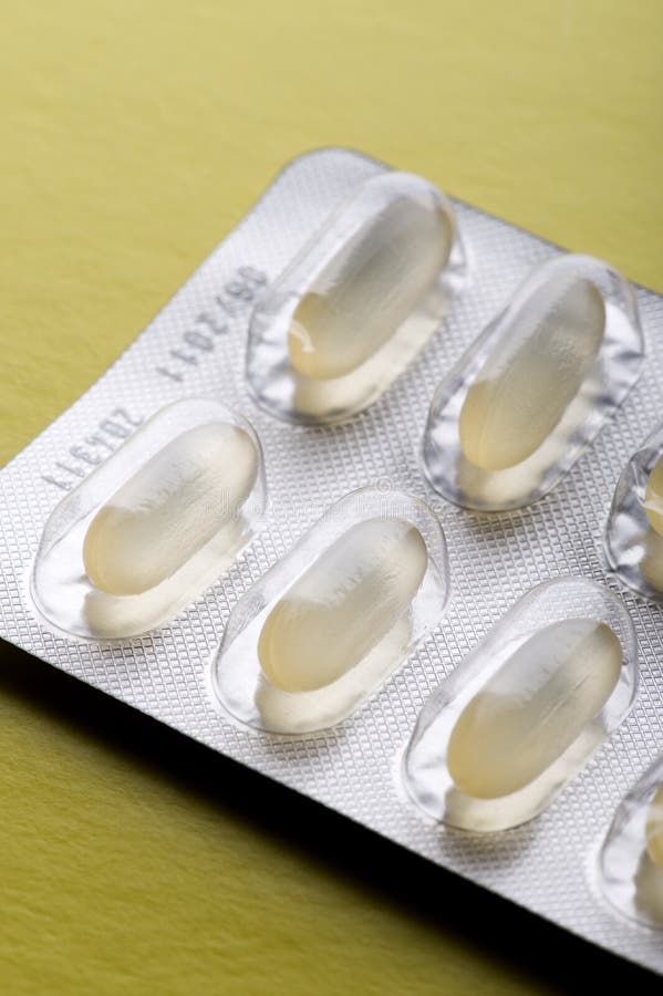 Pharmacy Medical Tablets on Yellow Stock Image - Image of medicine ...