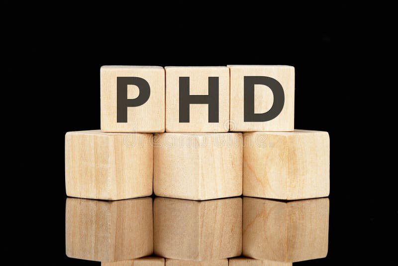 PHD Text Assembled from Wooden Cubes on a Black Background Stock Photo ...