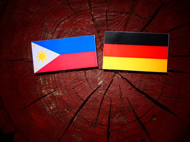 Philippines Flag with German Flag on a Tree Stump Isolated Stock Photo ...
