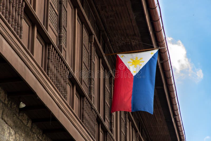 Philippines Flag Hoisted on House Eaves Stock Photo - Image of ...