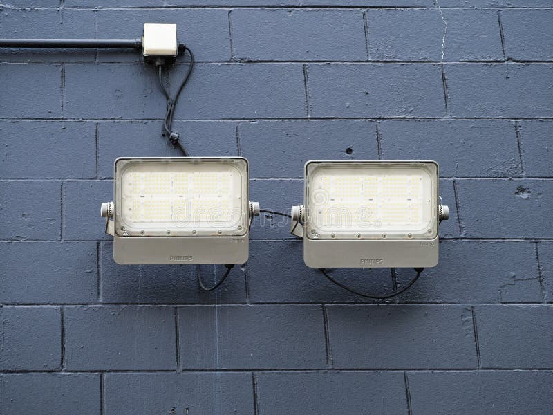 Philips Tango Industrial LED Floodlights Mounted at Dark Brick Wall ...