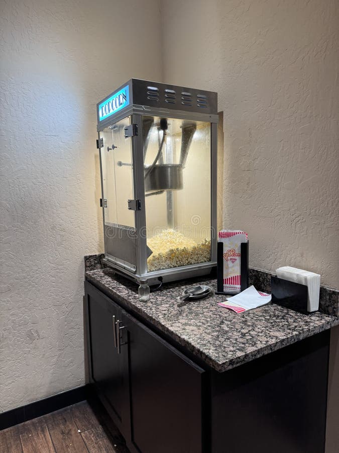 Popcorn Maker Filled with Buttery Popcorn for Self Serve Editorial ...