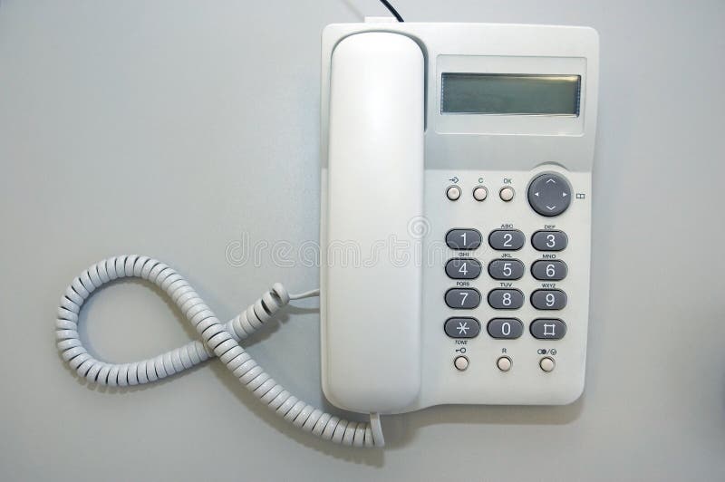 White Office Desk Telephone with Coiled Phone Cord Stock Image - Image ...