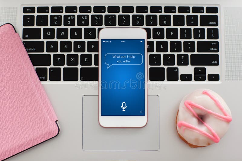 Phone with App Personal Assistant Screen on Notebook Keyboard Stock ...
