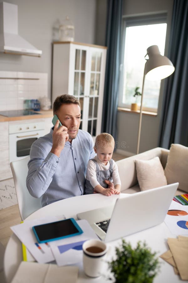 Mature Father Sitting with His Daughter and Having a Phone Call Stock ...