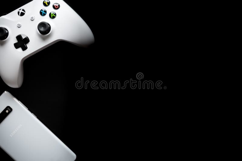 A Phone and Controller Sit Side by Side As Gaming Becomes Multi ...