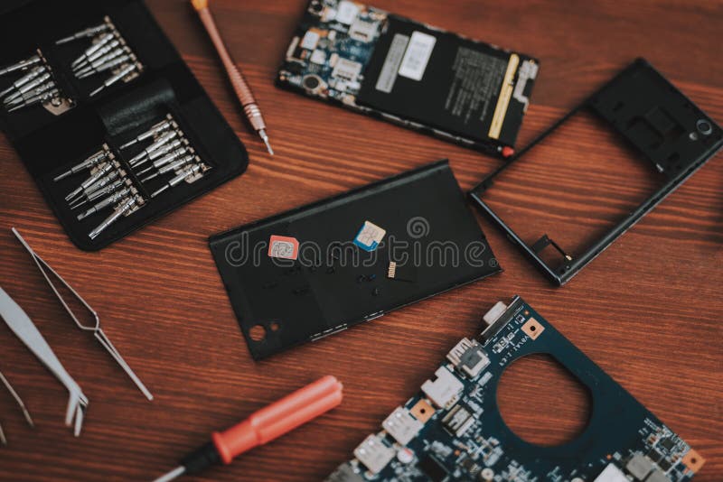 Phone and Details with Tools on Wooden Table. Stock Image - Image of ...