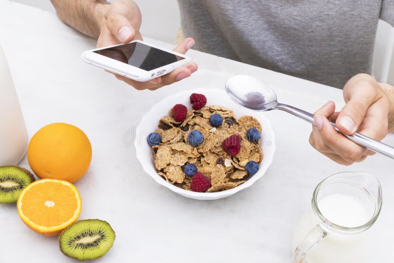 Phone hands at breakfast stock photo. Image of mobile - 134801212