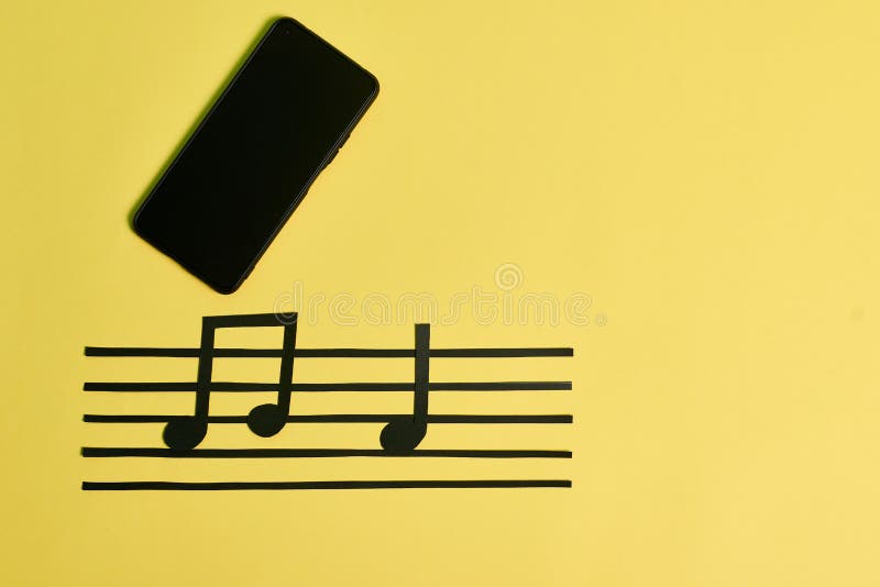 A Phone and Music Notes on a Yellow Background Stock Photo - Image of ...