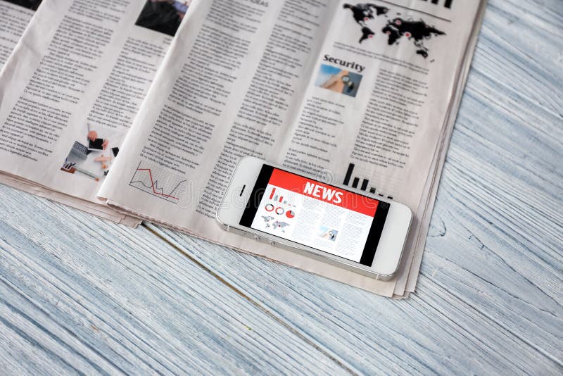 Phone with News on Screen and Newspaper on Wooden Table Stock Image ...