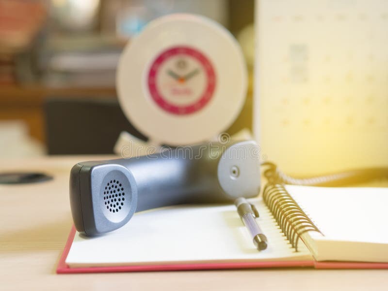 Phone, Notebook, Pen and Clock on the Desk . Stock Photo - Image of ...