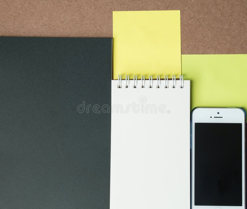 Phone and Notebooks, Post-it on the Brown Background Stock Photo ...