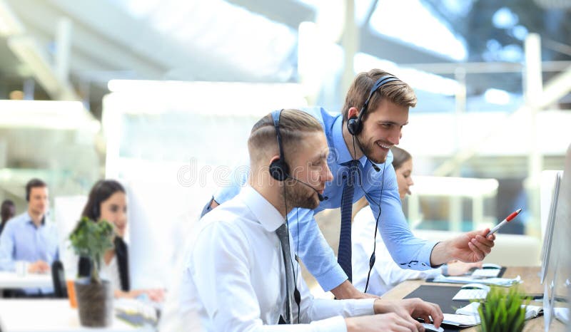 Phone Operator Working at Call Centre Office Helping Hiss Colleague ...