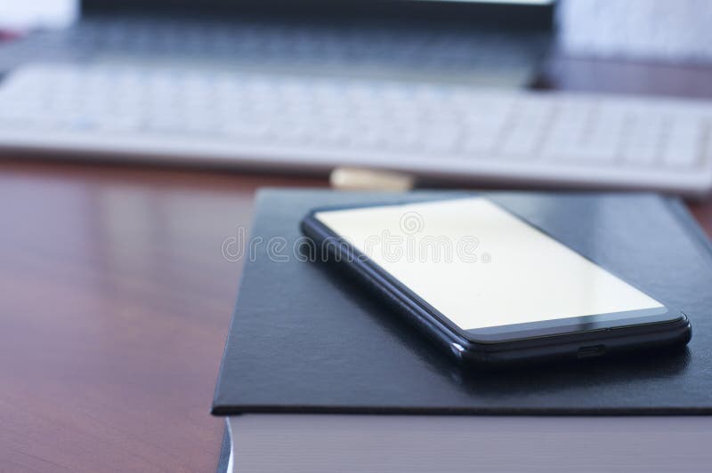 Phone on the Book. Blank White Screen. Computer Keyboard. Office ...