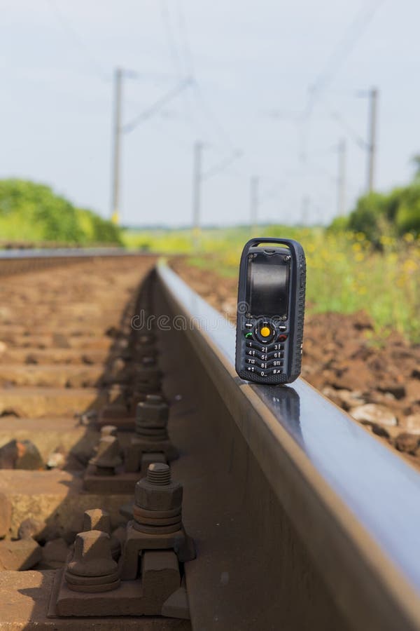 Rugged Mobile Phone on a Train Rail Stock Image - Image of environment ...
