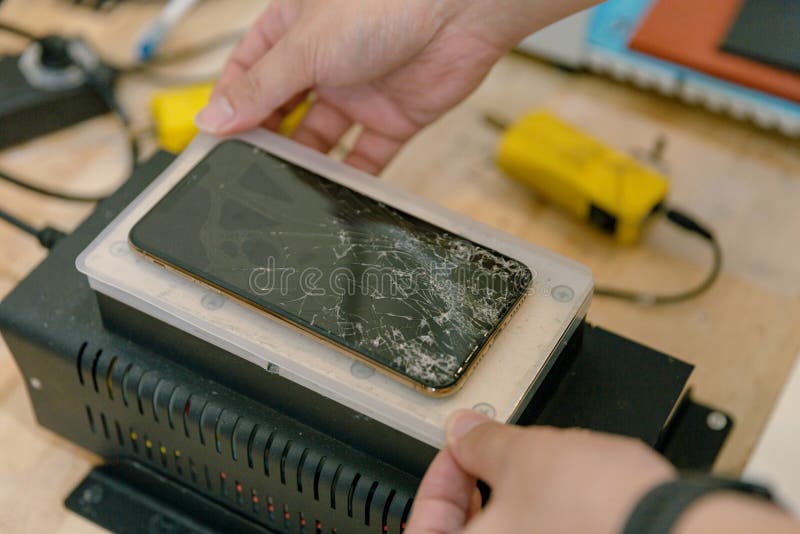 Phone Repair Concept a Smartphone with Broken Screen Being Repaired ...